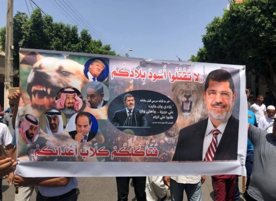 Algeria-banner-with-Morsi-Gulf-Arabs - Just World Educational